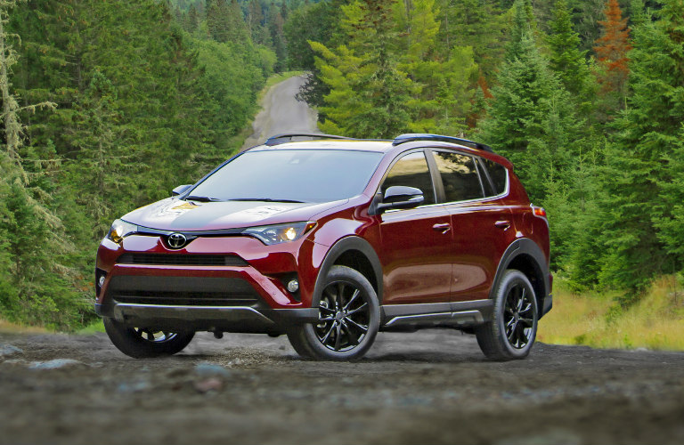 2018-Toyota-RAV4-in-red-parked-on-a-road-in-the-woods_o - Ackerman Toyota