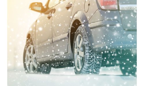 Low angle of car tires in snow